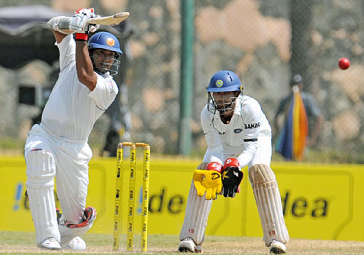 Indian players wait for a third-umpire review for a leg-before appeal ...