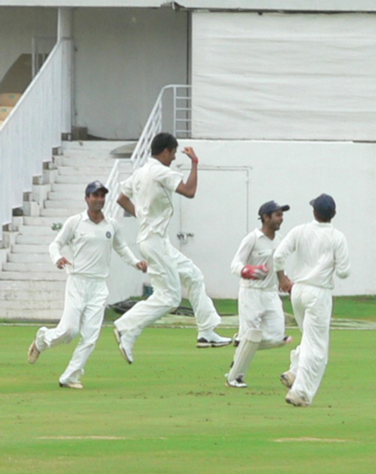 Isa Guha in action in the brief spell before the rain returned ...