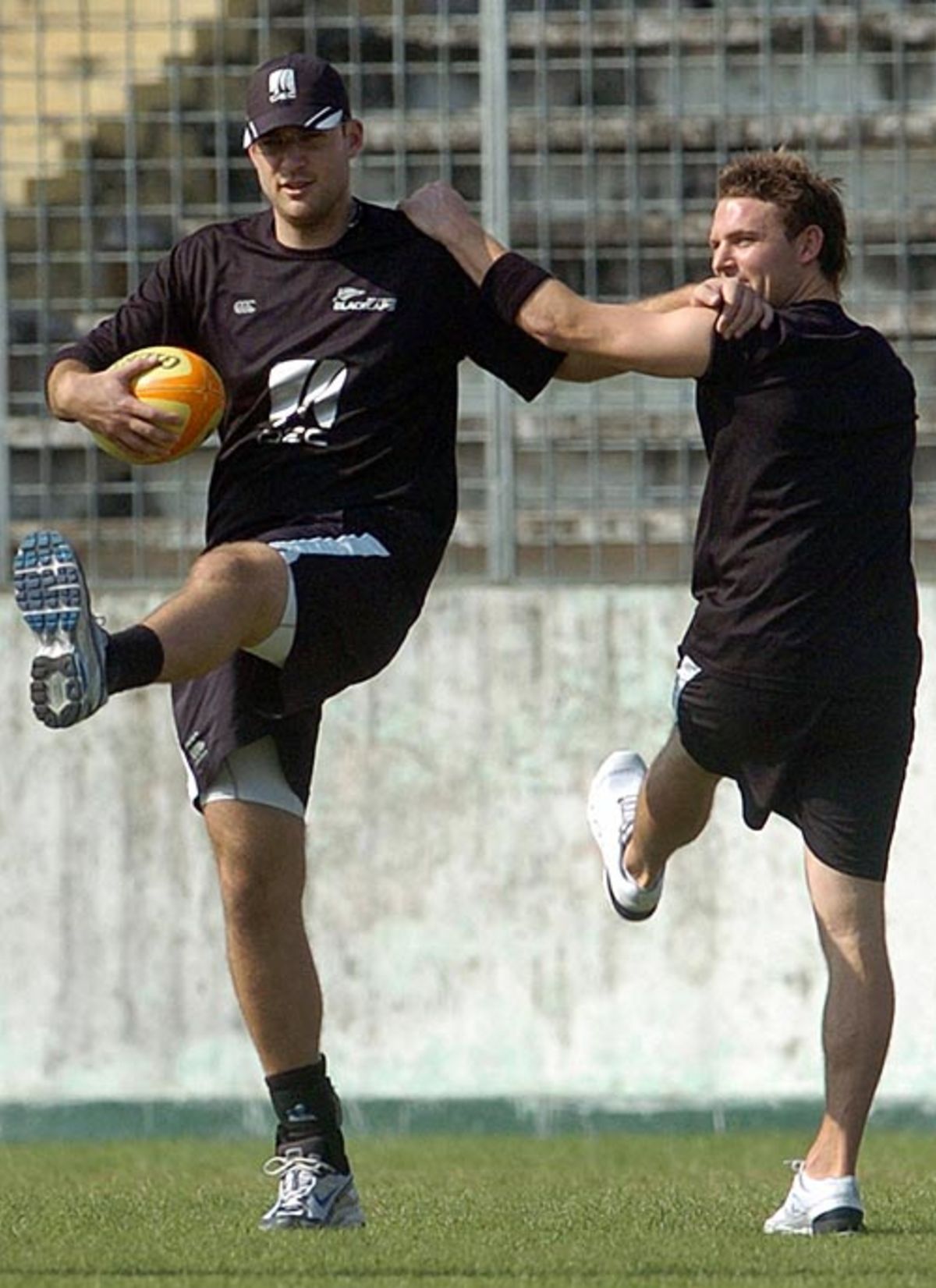 Daniel Vettori and Brendon McCullum looosen up during practice ...
