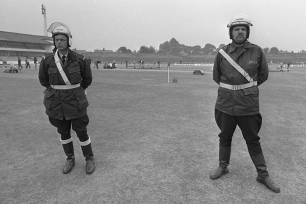 Policemen guard the Headingley pitch after vandals dug it up ...