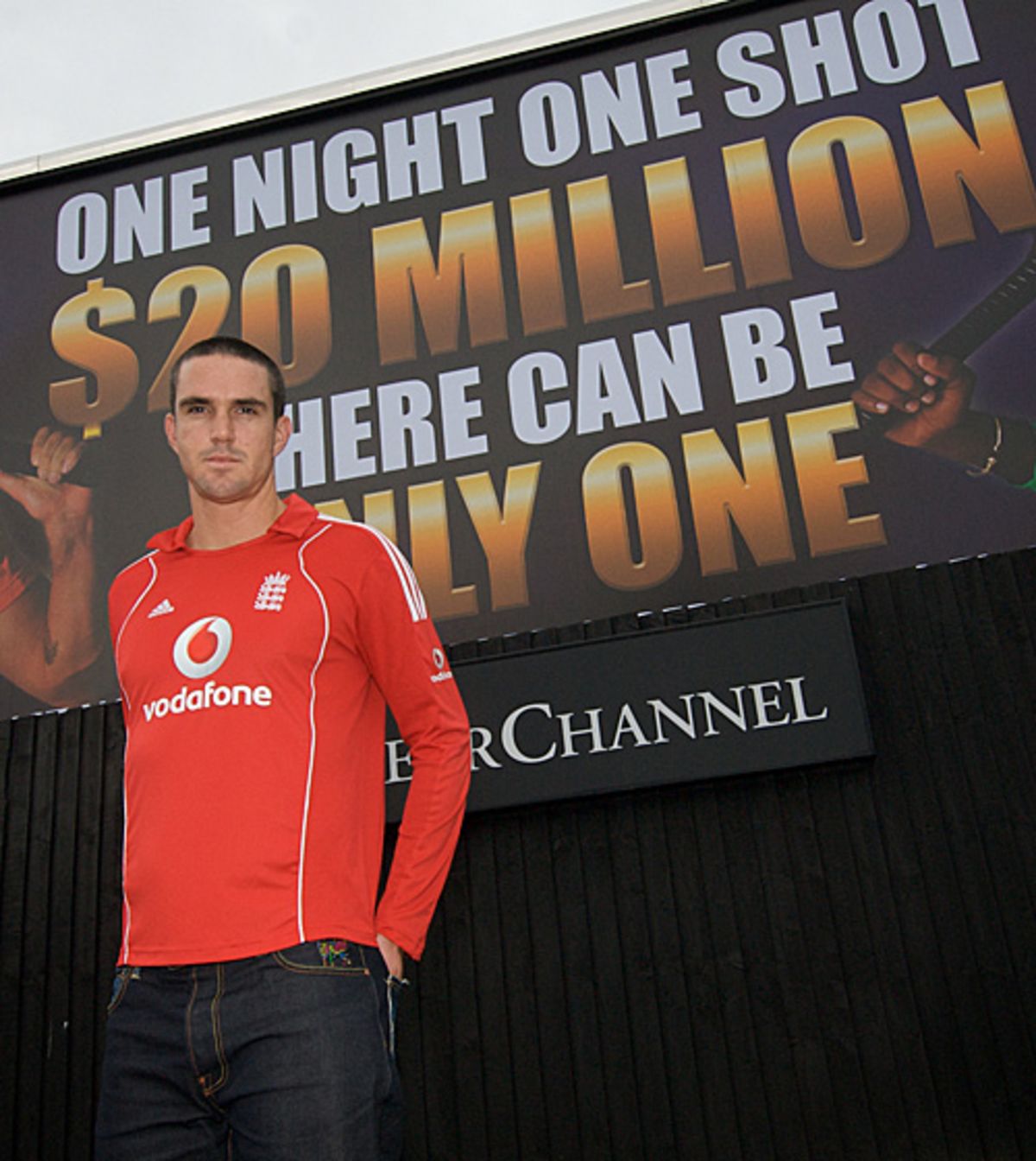 Kevin Pietersen stands in front of a billboard advertising the Stanford ...