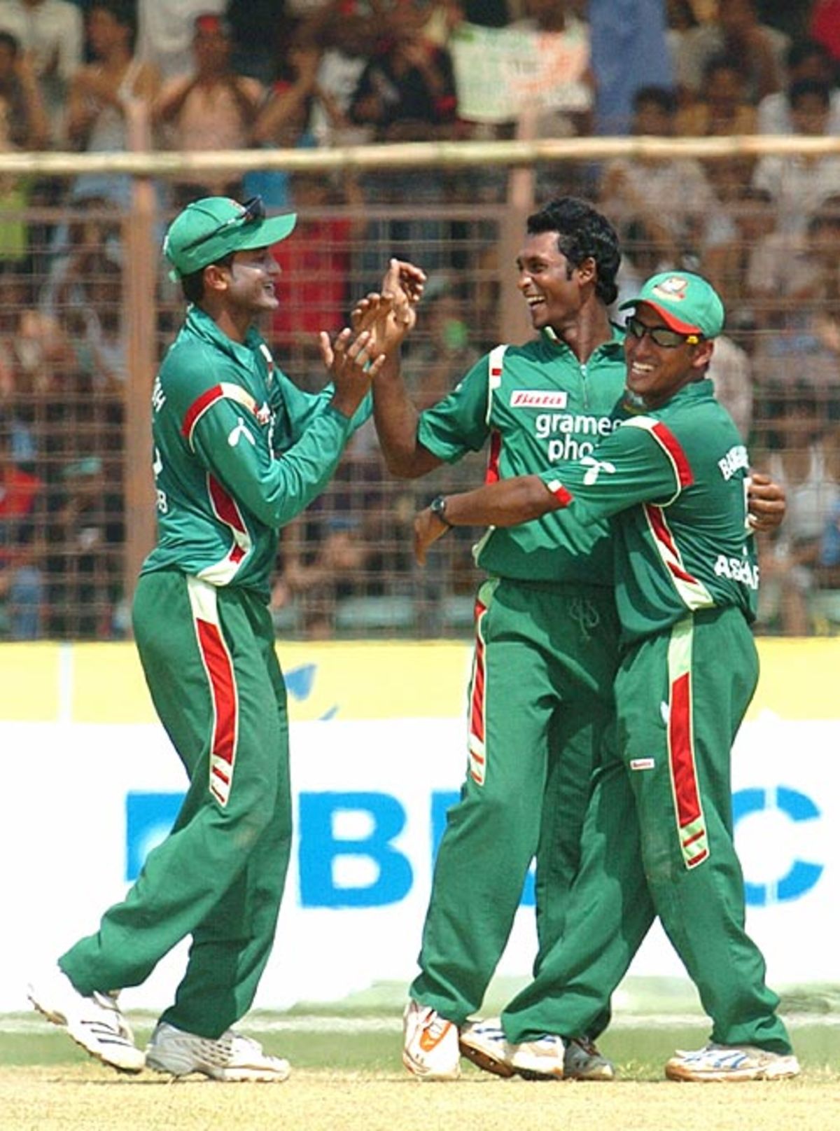 Naeem Islam gets the congratulations from team-mates after picking up ...