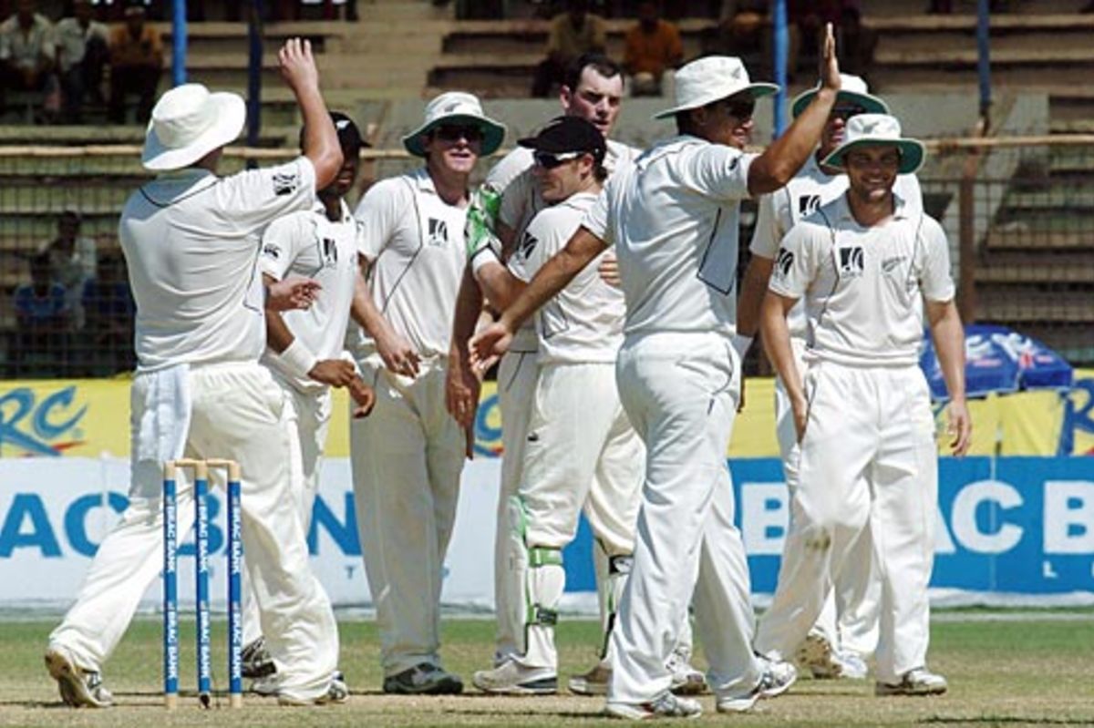 New Zealand players celebrate the fall of another Bangladesh wicket ...