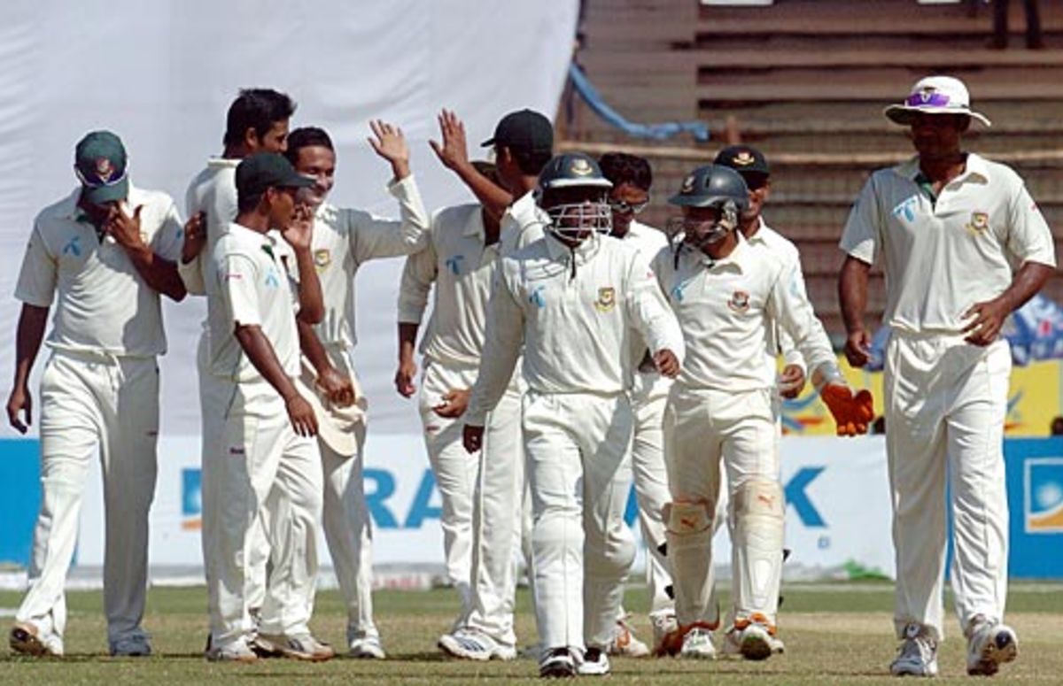 New Zealand players celebrate the fall of another Bangladesh wicket ...