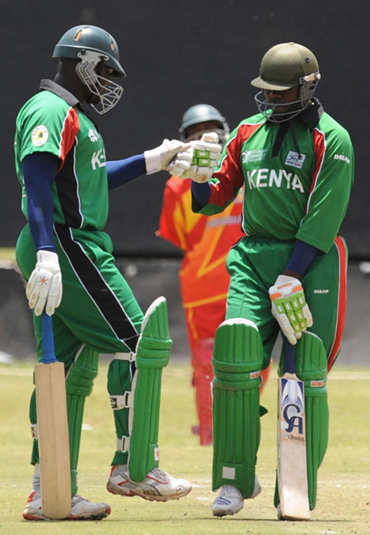 Thomas Odoyo congratulates Steve Tikolo for reaching his century ...