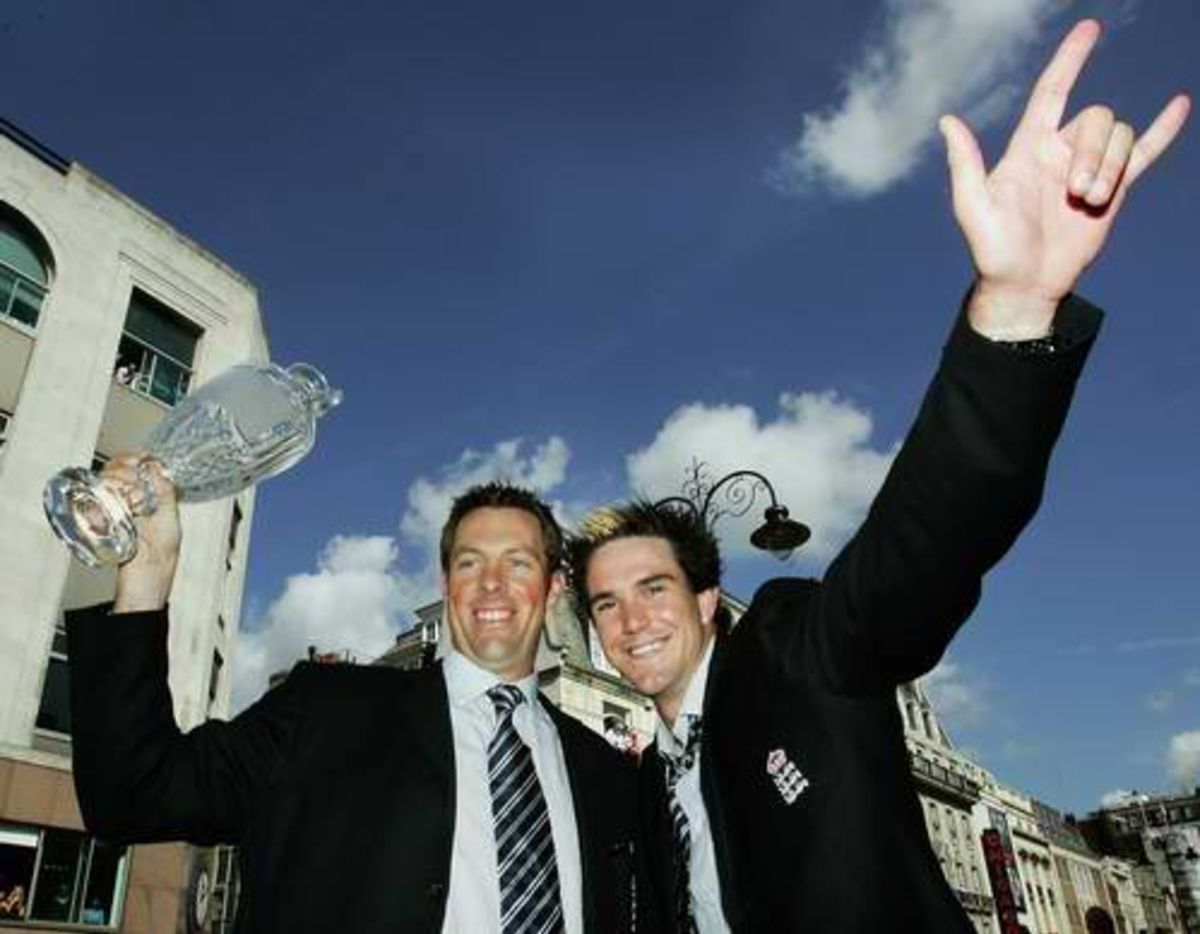 Michael Vaughan, Gary Pratt and Andrew Flintoff ride on top of the bus ...