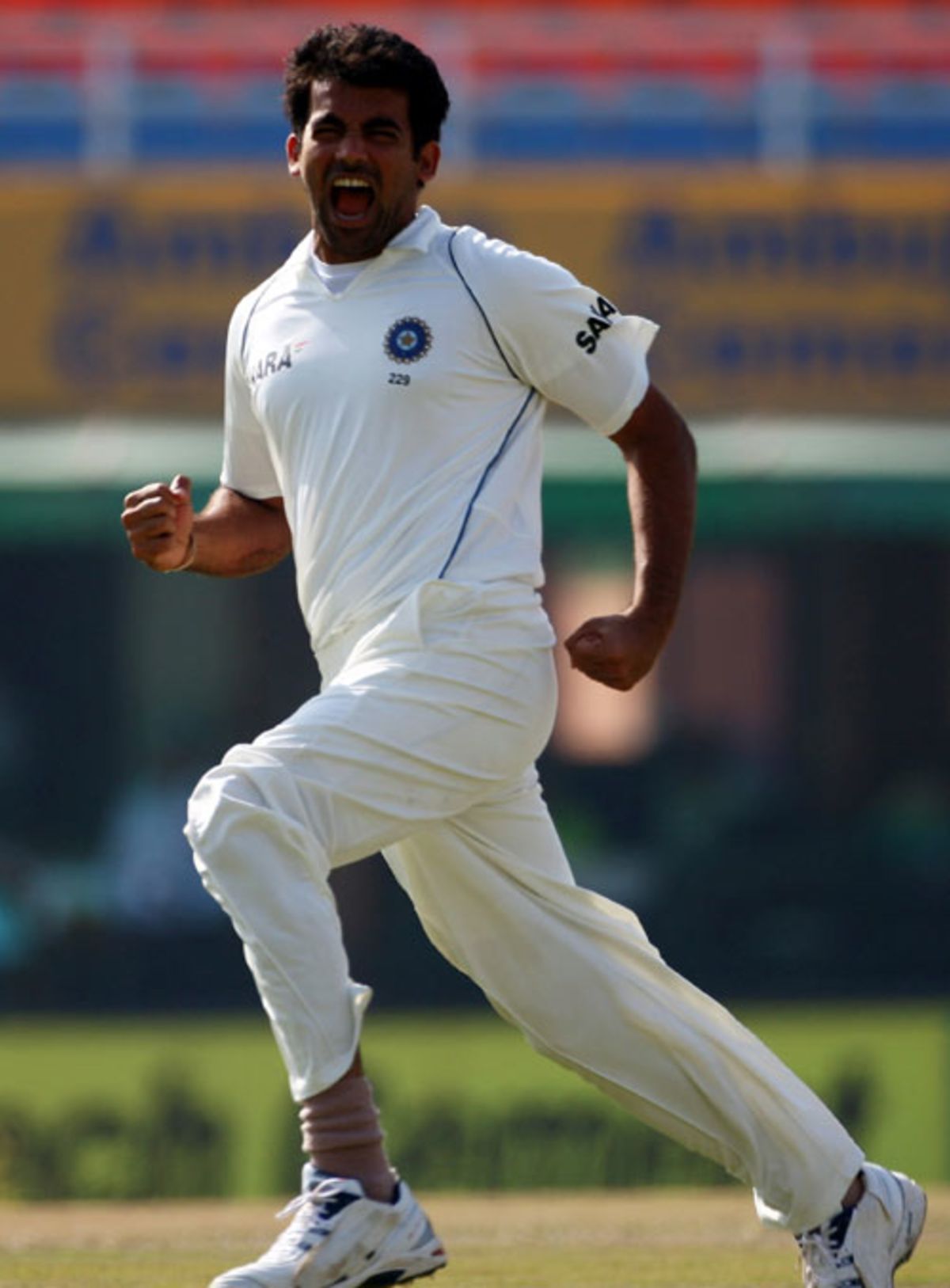 Cameron White looks back after nicking Zaheer Khan to the keeper ...