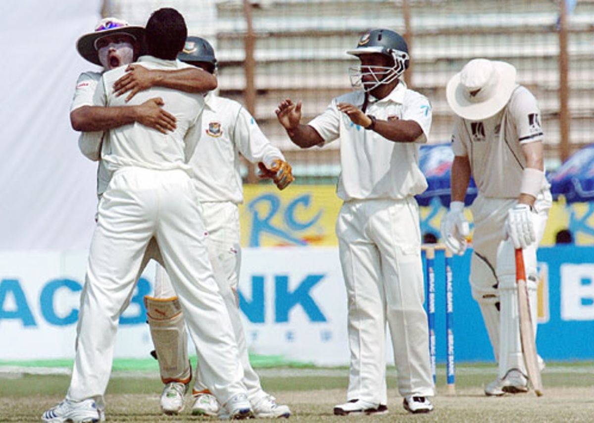 Cameron White looks back after nicking Zaheer Khan to the keeper ...