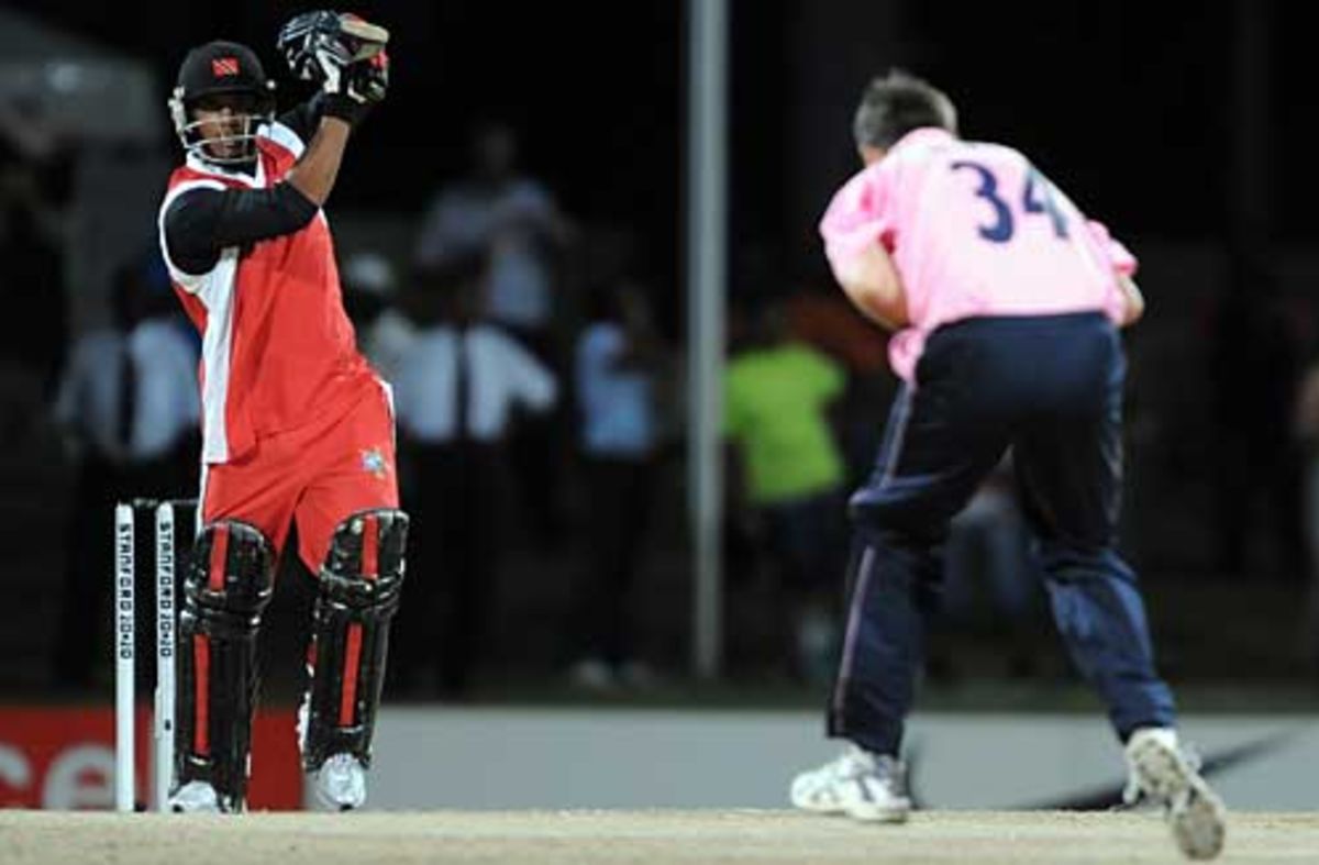 William Perkins drives a catch straight back at Tim Murtagh ...