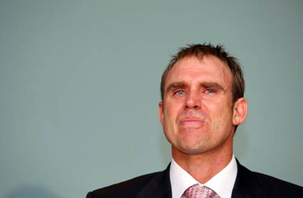 Matthew Hayden holds his son Thomas as he announces his retirement ...