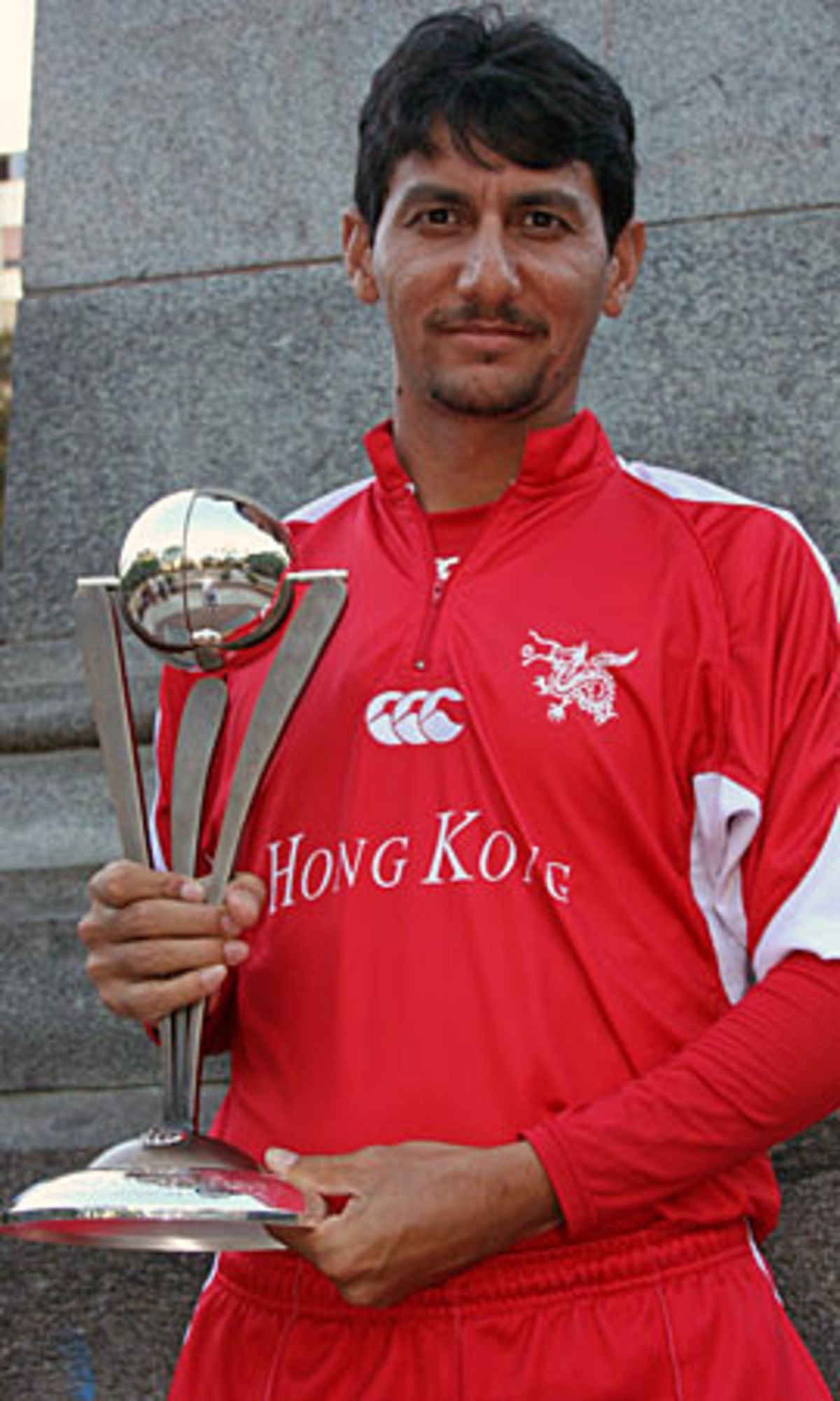 Hong Kong's skipper Tabarak Dar poses with the ICC WCL Division 3 Trophy | ESPNcricinfo.com
