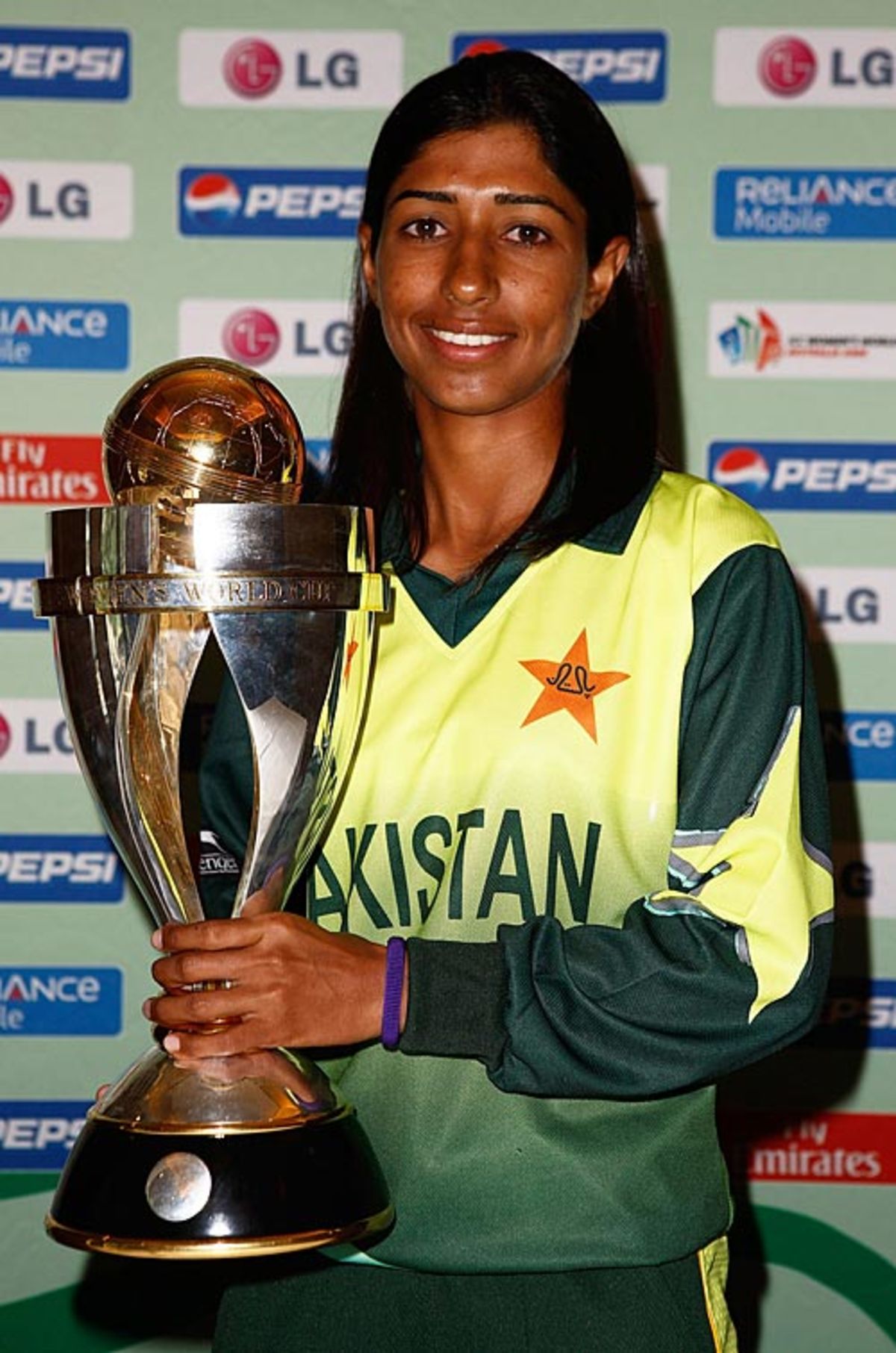 Urooj Mumtaz poses with the 2009 Women's World Cup trophy ...