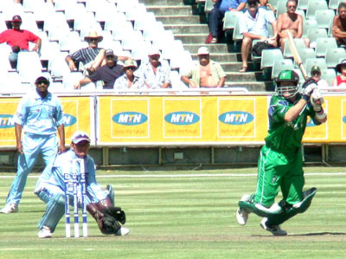 Jonty Rhodes sets off on a run after playing a ball into the covers ...