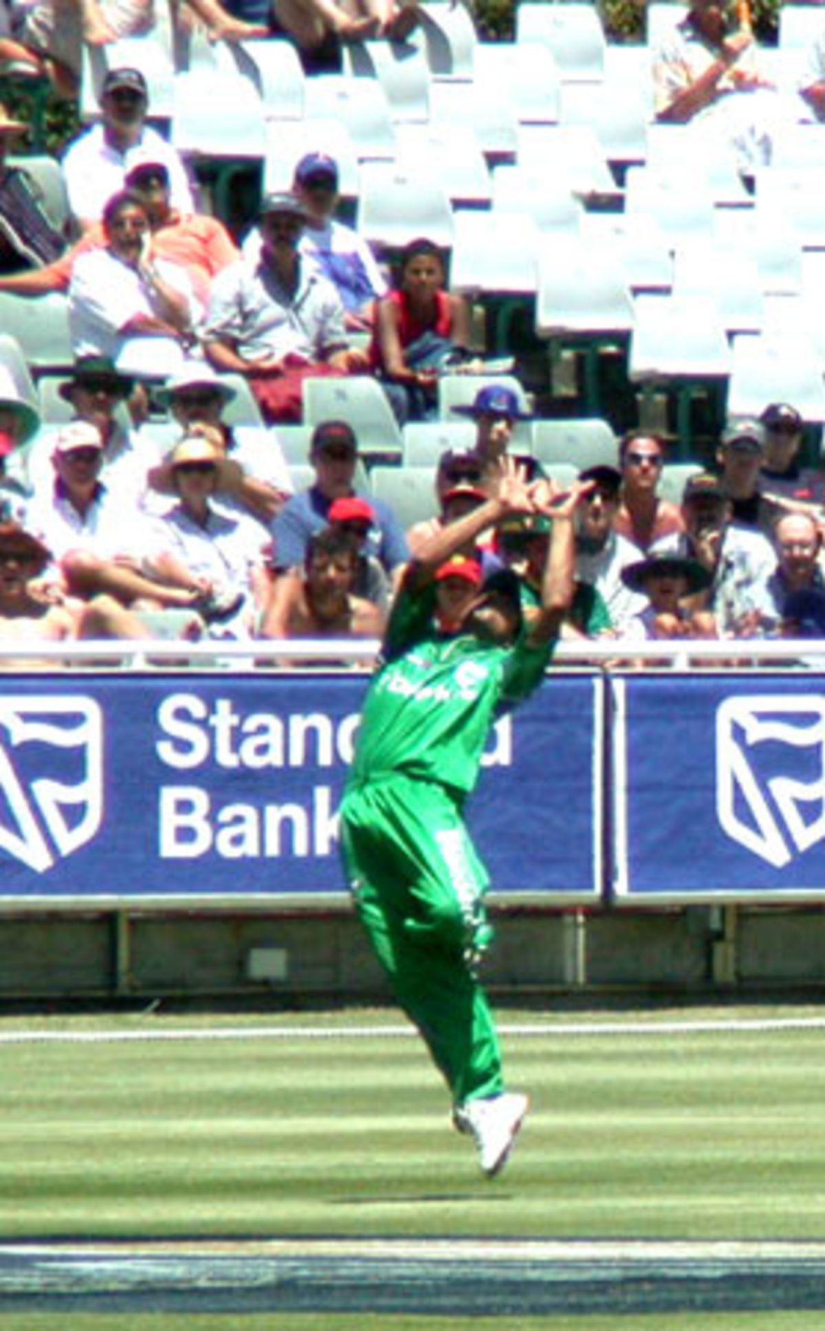 Goolam Bodi is airborne as he catches Kruger van Wyk of the Titans ...