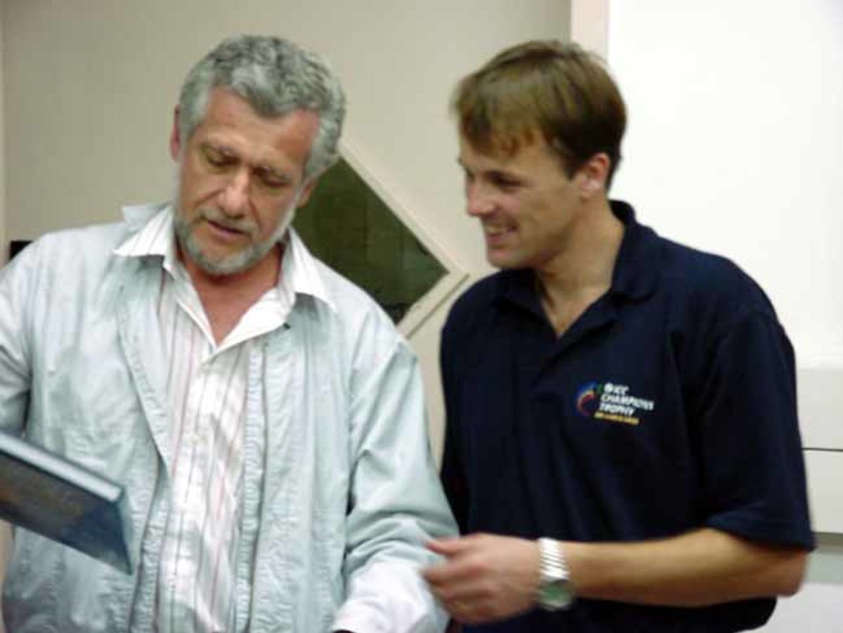 ICA Chairman Stanley Perlman presents Roland Lefebvre with a book in ...