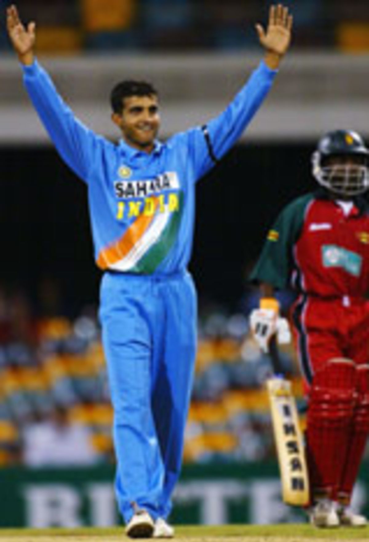 Sourav Ganguly smiling, hands aloft after taking another wicket ...