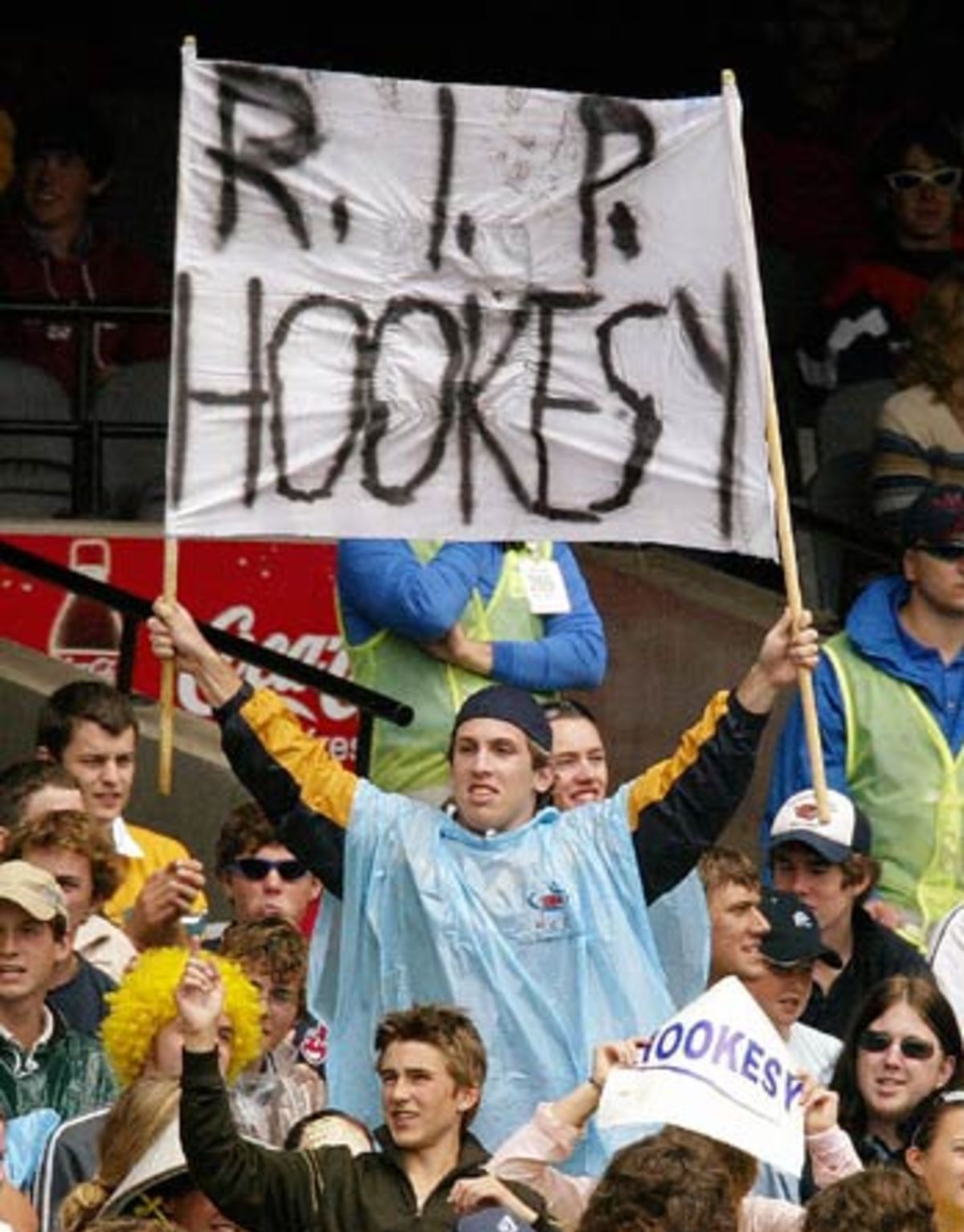 People in the stands hold banners in the memory of David Hookes ...
