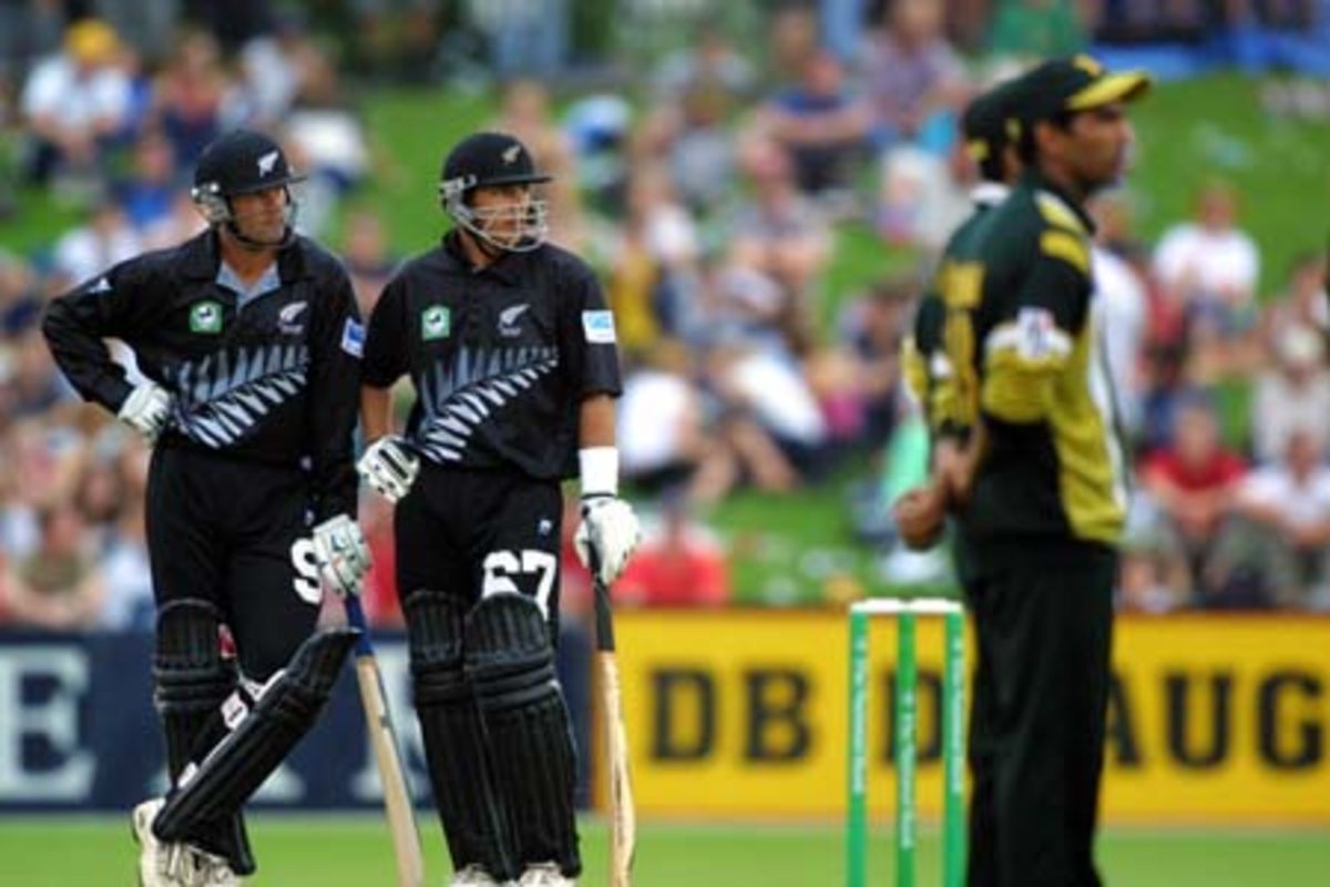 Fleming jumps to play a short rising ball down on the leg side ...