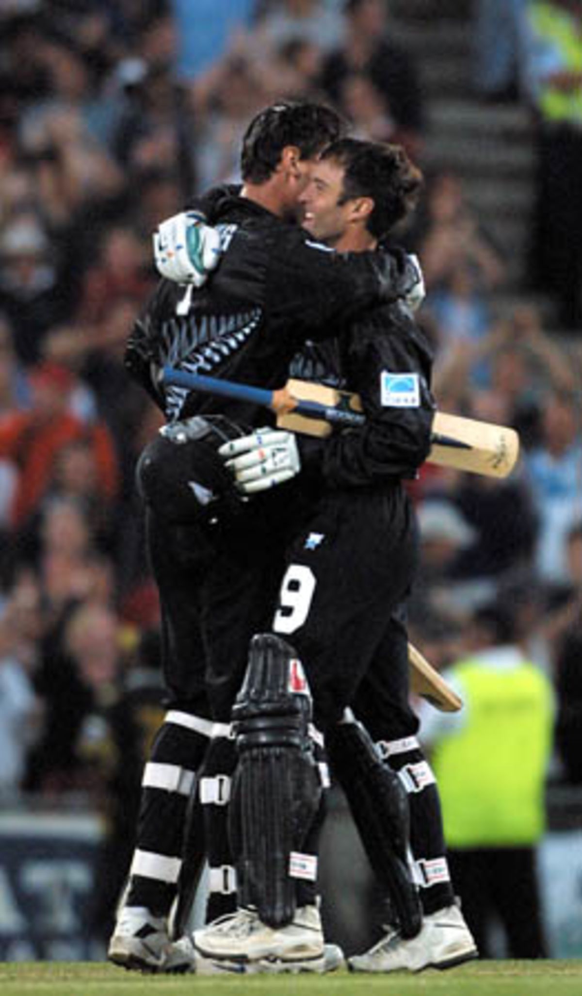 Astle is hugged by Fleming upon reaching his century | ESPNcricinfo.com