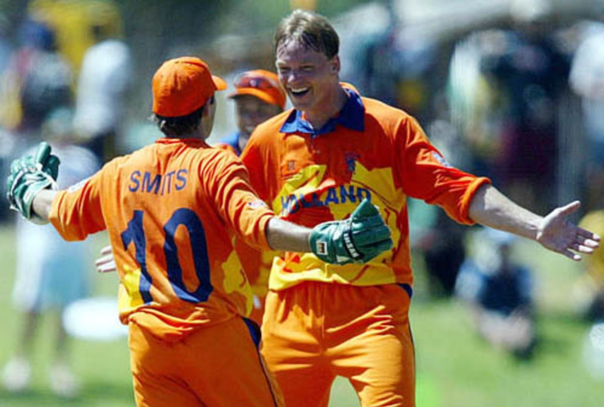 Dutch wicketkeeper Jeroen Smits and team mate Tim De Leede celebrate ...