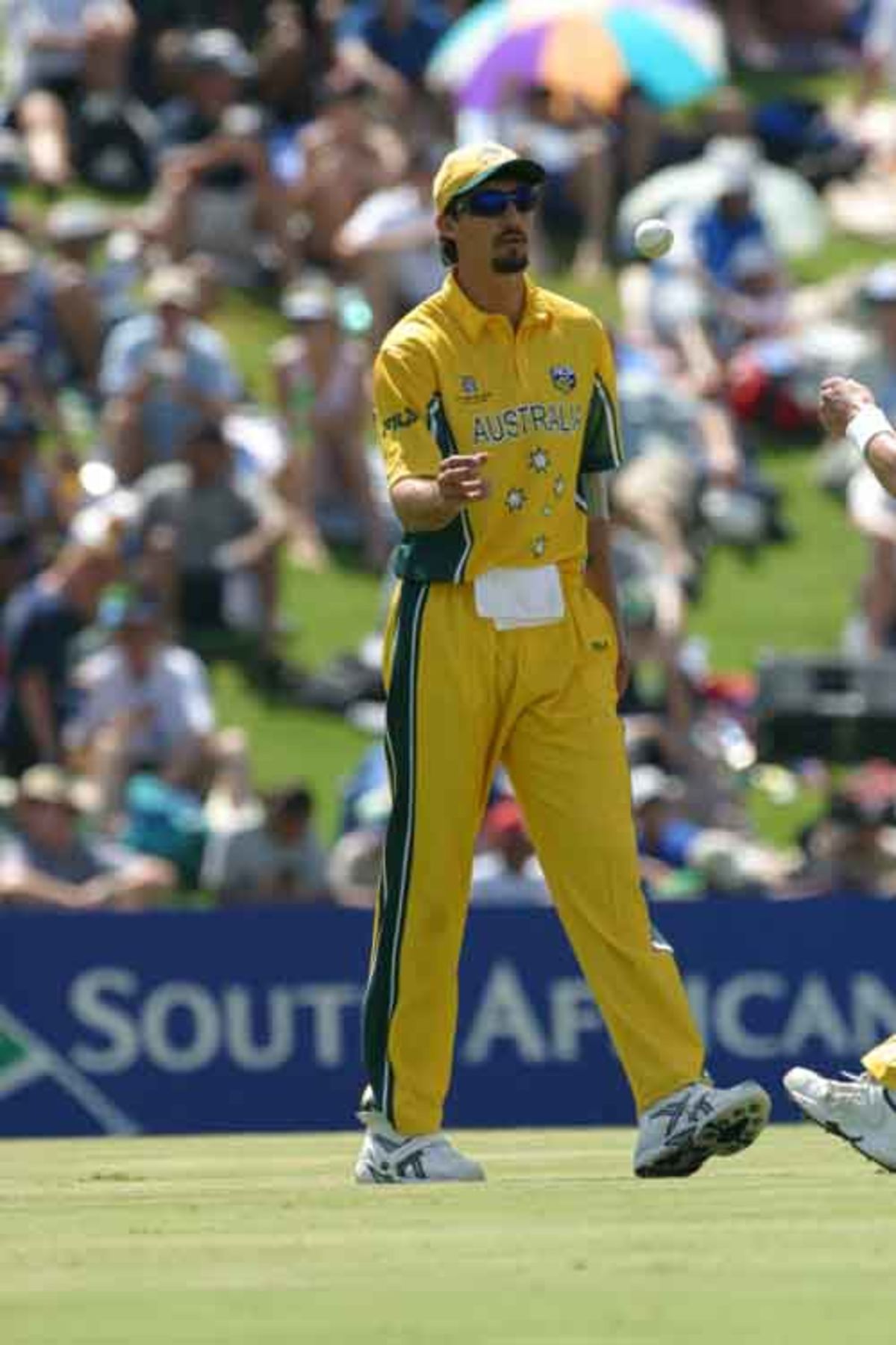 Matthew Hayden sweeps a delivery as Indian wicket-keeper Rahul Dravid ...