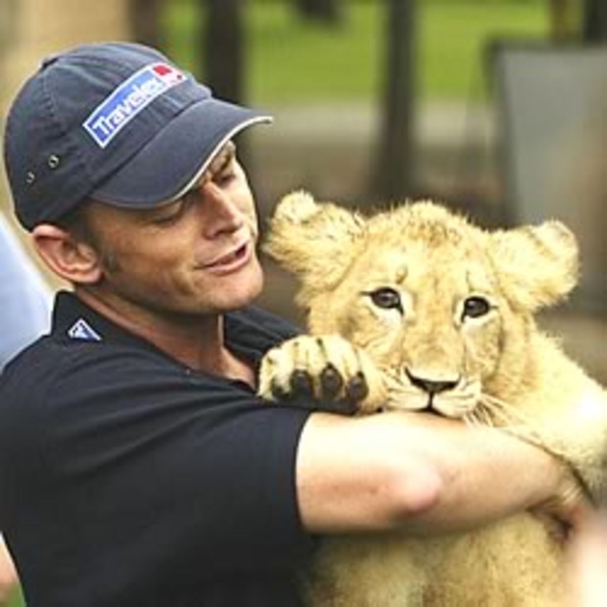 Gilchrist meets a lion cub, South Africa, 2002/03 | ESPNcricinfo.com