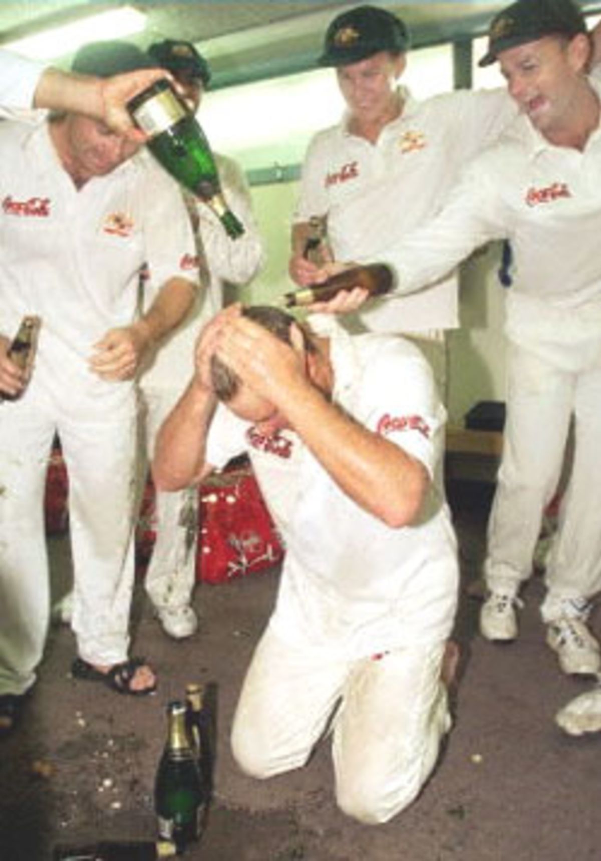Shane Warne sprayed with champagne by team mates after breaking record ...