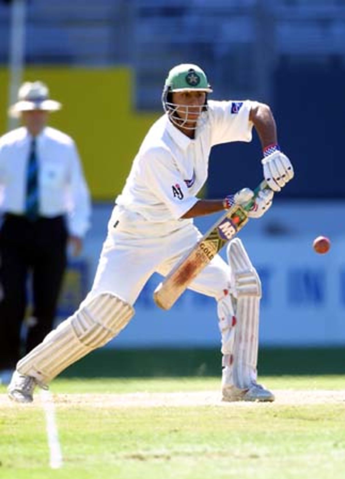 Faisal plays defensively during his innings of 52 not out ...