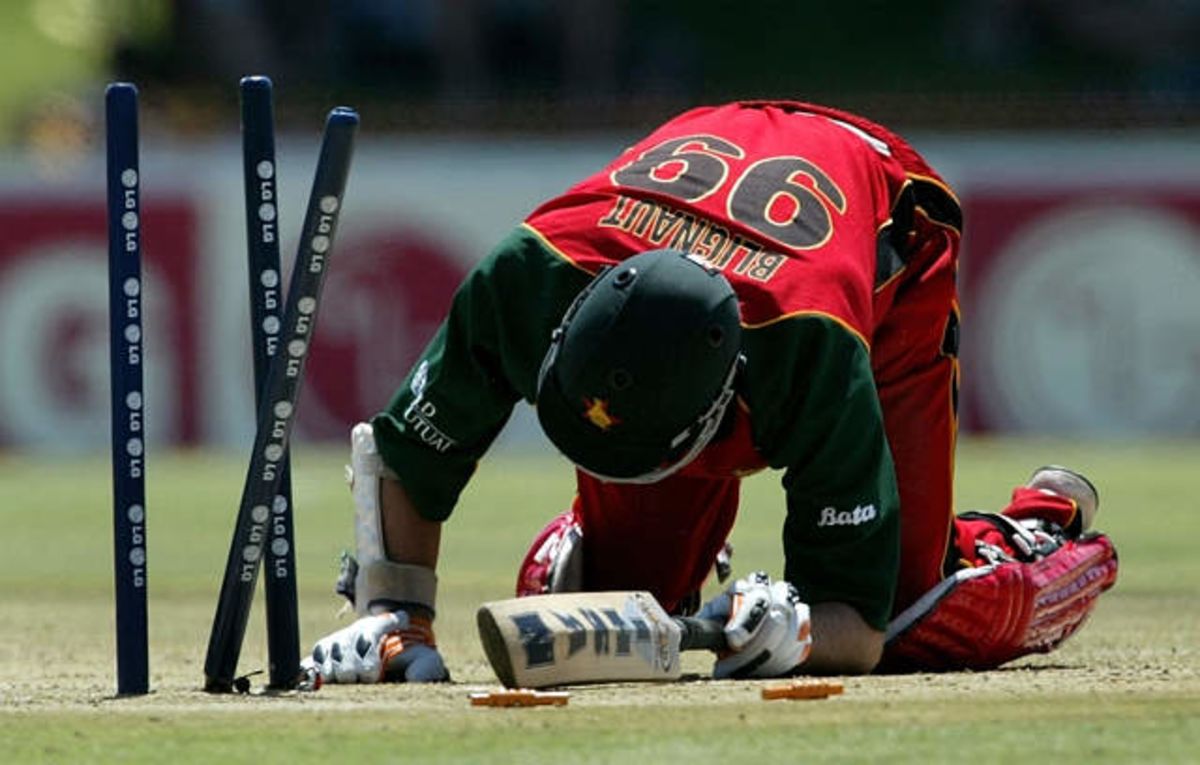 Andy Blignaut and Douglas Marillier miss a ball hit high off the bat of ...