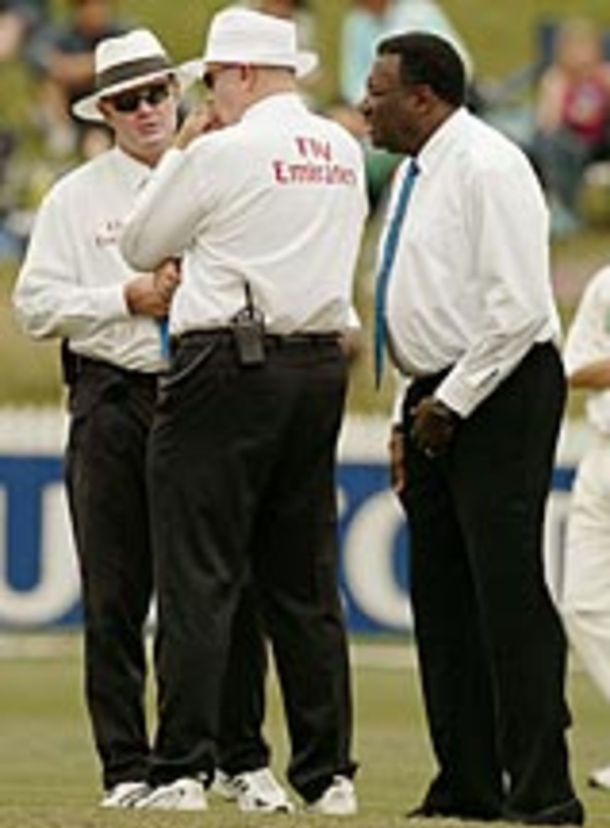 Clive Lloyd discusses the state of the pitch with umpires Russel Tiffin ...