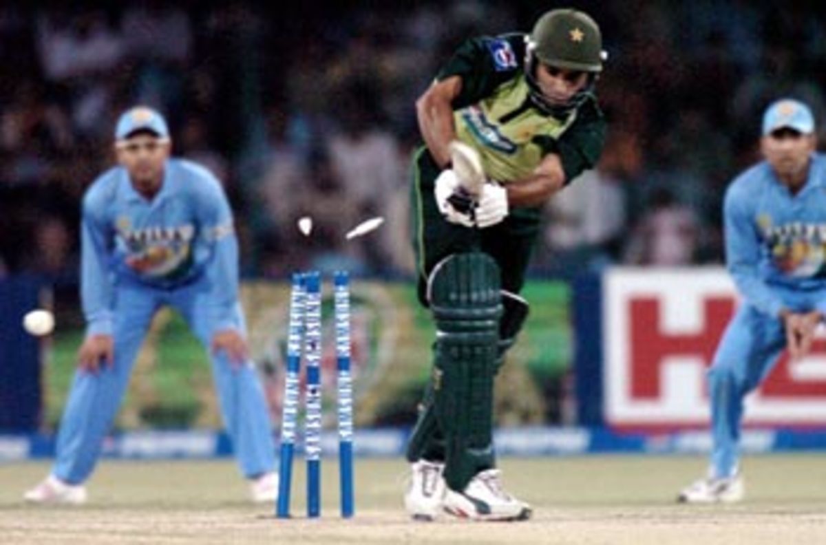 Pakistani batsman Taufeeq Umar is clean bowled by Indian pace bowler ...