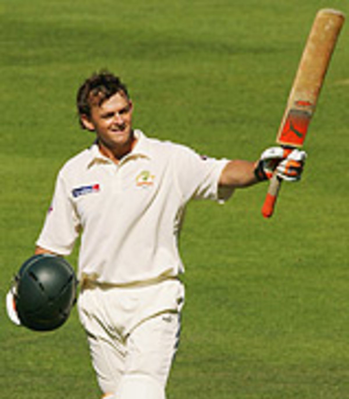 Adam Gilchrist raises his bat on reaching a century | ESPNcricinfo.com