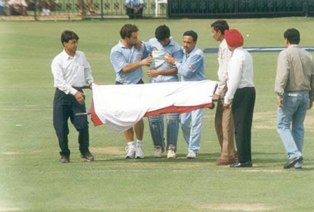 Ganguly being helped off the field | ESPNcricinfo.com