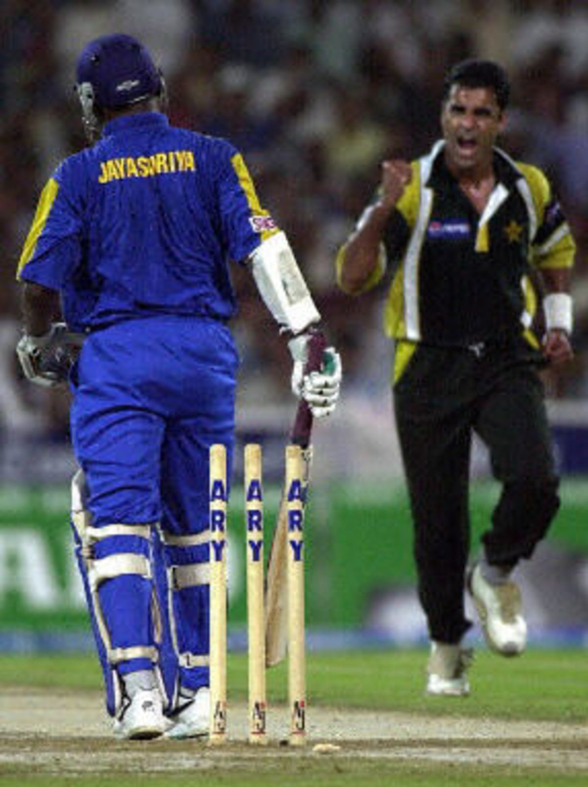 Waqar Younis jubilates after clean bowling Sanath Jayasuriya ...