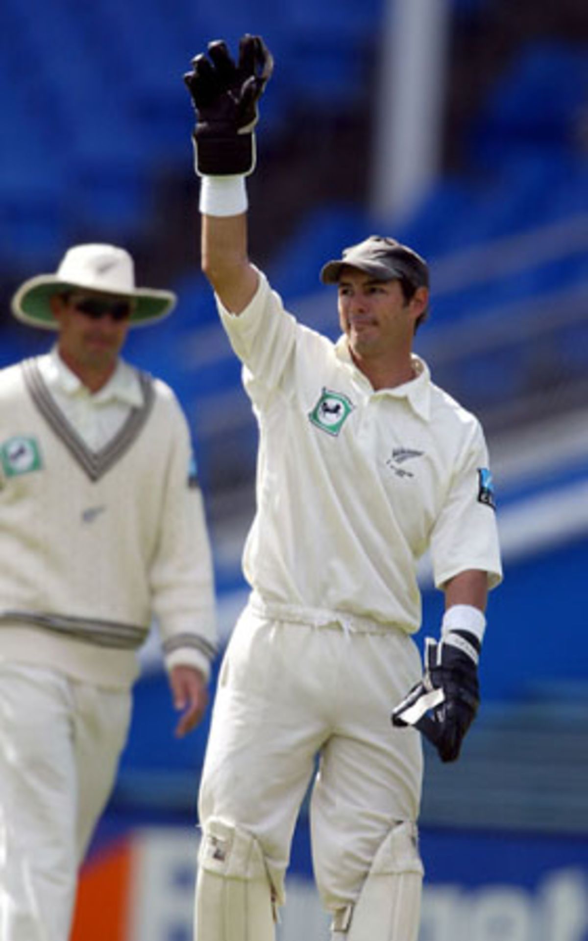 Parore acknowledges the crowd after taking his 200th wicket-keeping ...