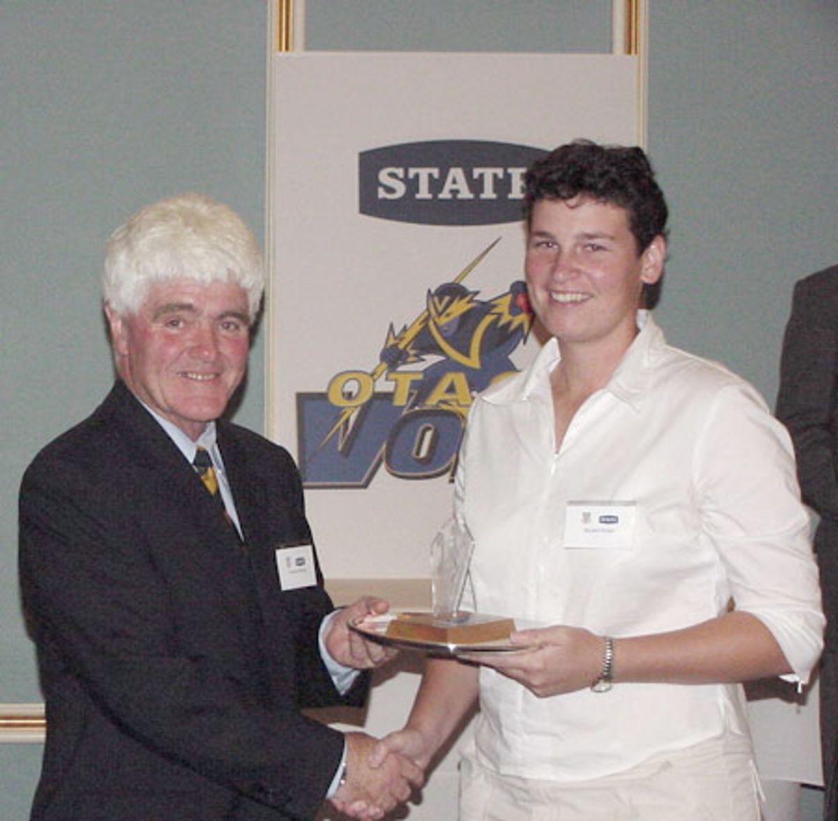 Morris is presented an award for his outstanding contribution to Otago ...