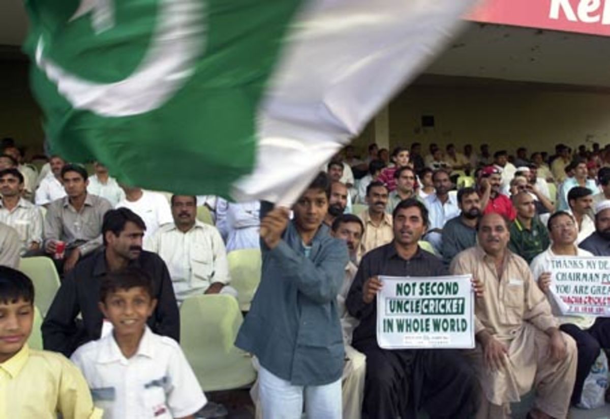A Cricket fan waves the Pakistani flag | ESPNcricinfo.com
