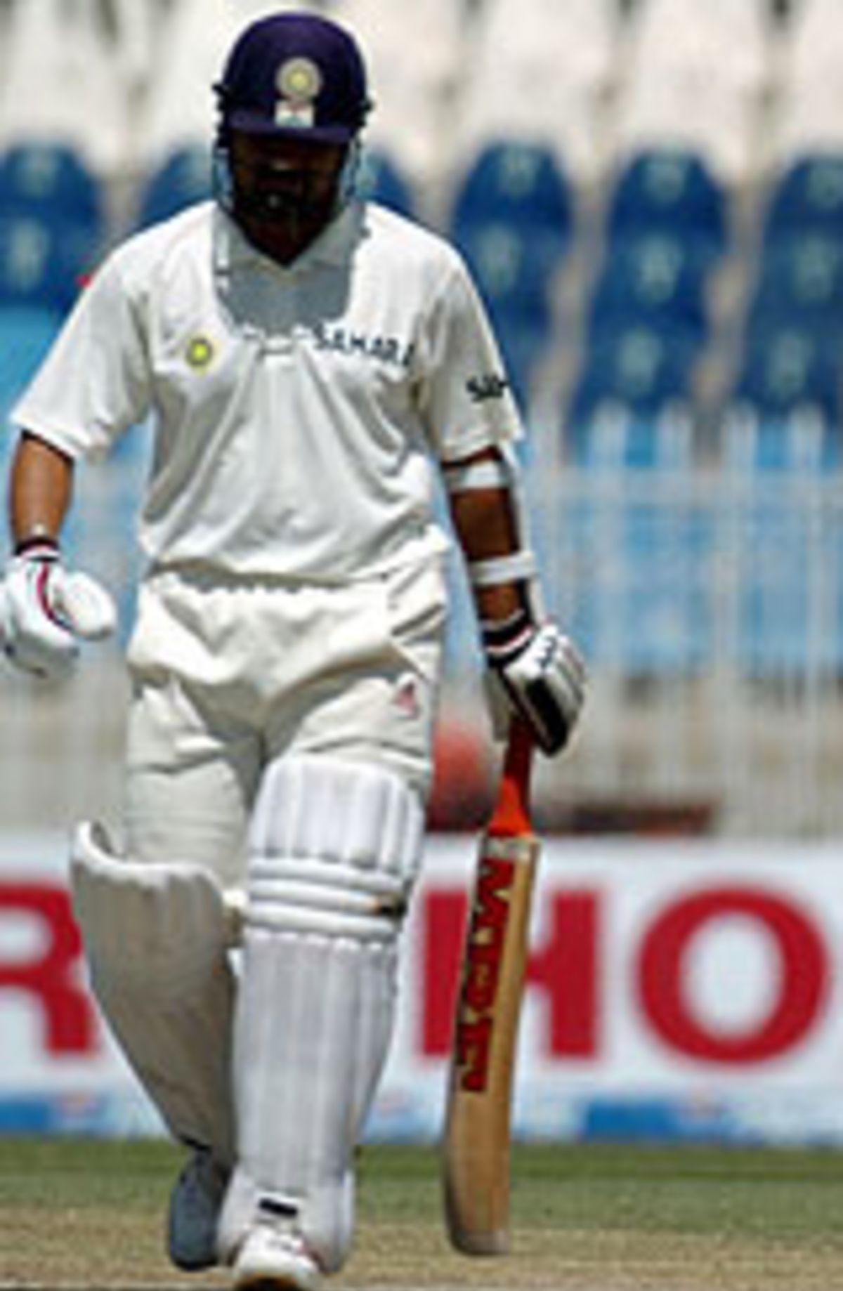 Sachin Tendulkar begins the long walk back after edging a delivery ...