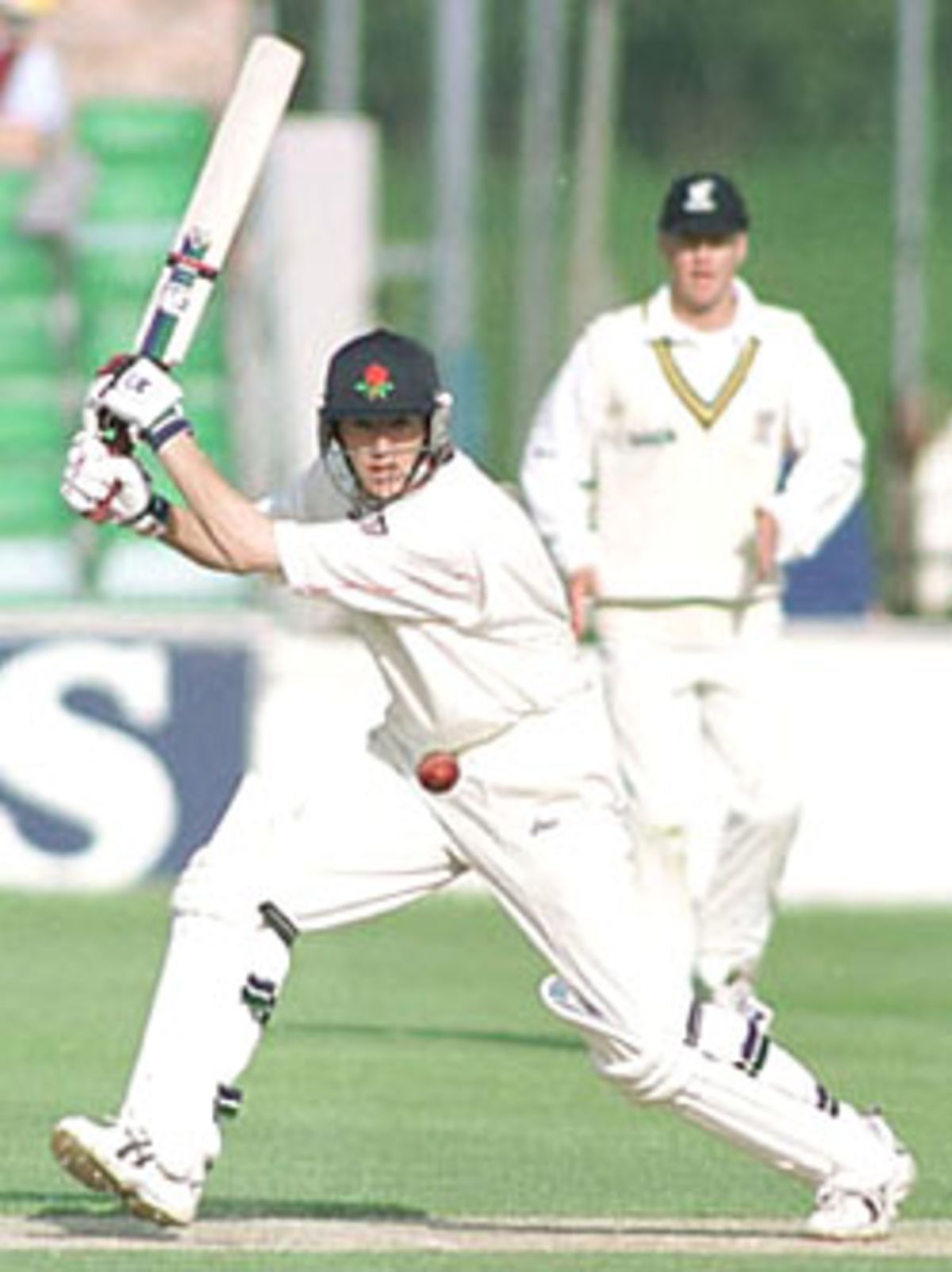 Chris Schofield executes a square cut while reaching his first half ...