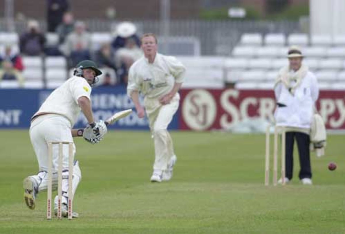 Derby's Tom Lungley sends a delivery past the bat of Sutcliffe ...