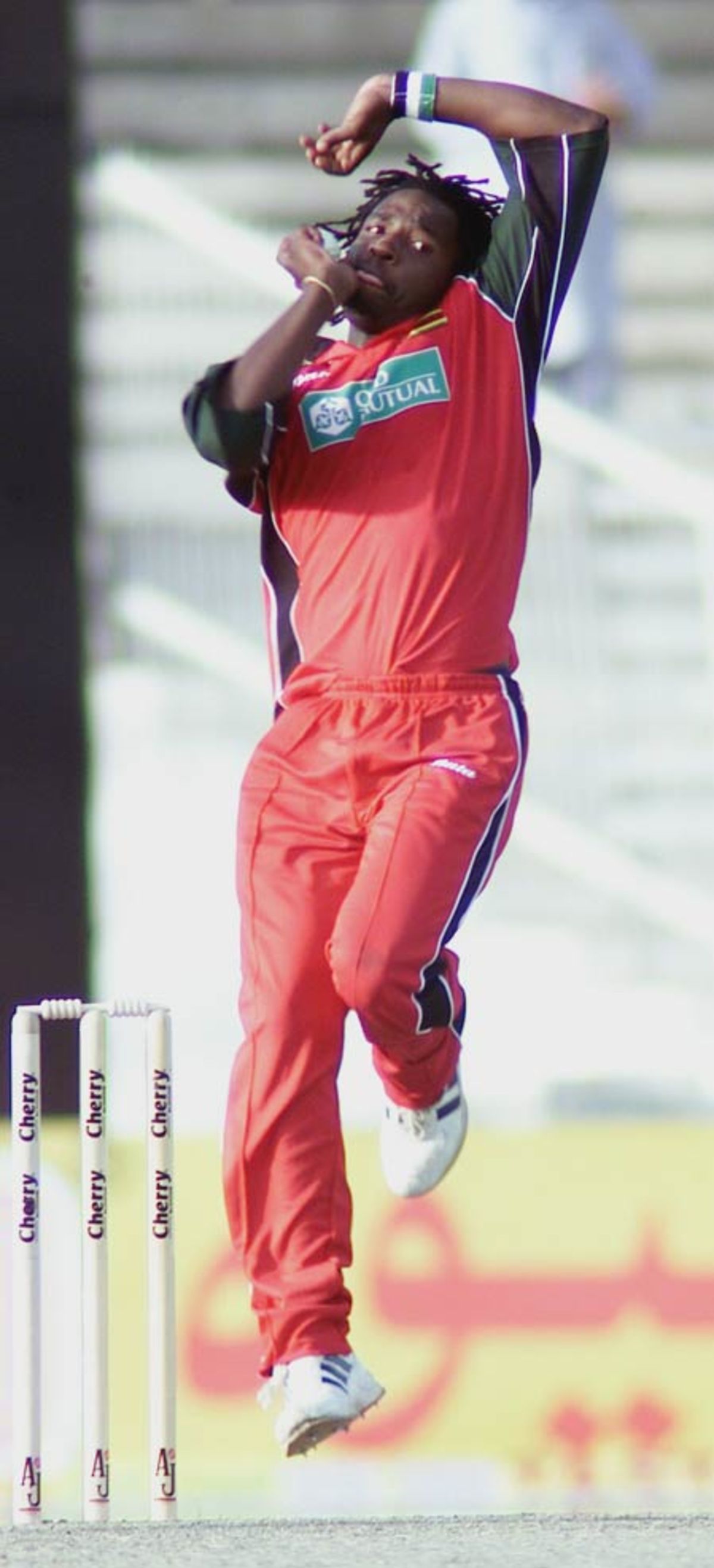 Douglas Hondo in his follow through | ESPNcricinfo.com