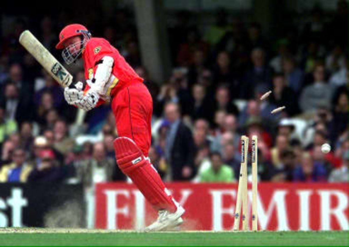 Zimbabwe opening batsman Grant Flower is clean bowled for two by ...