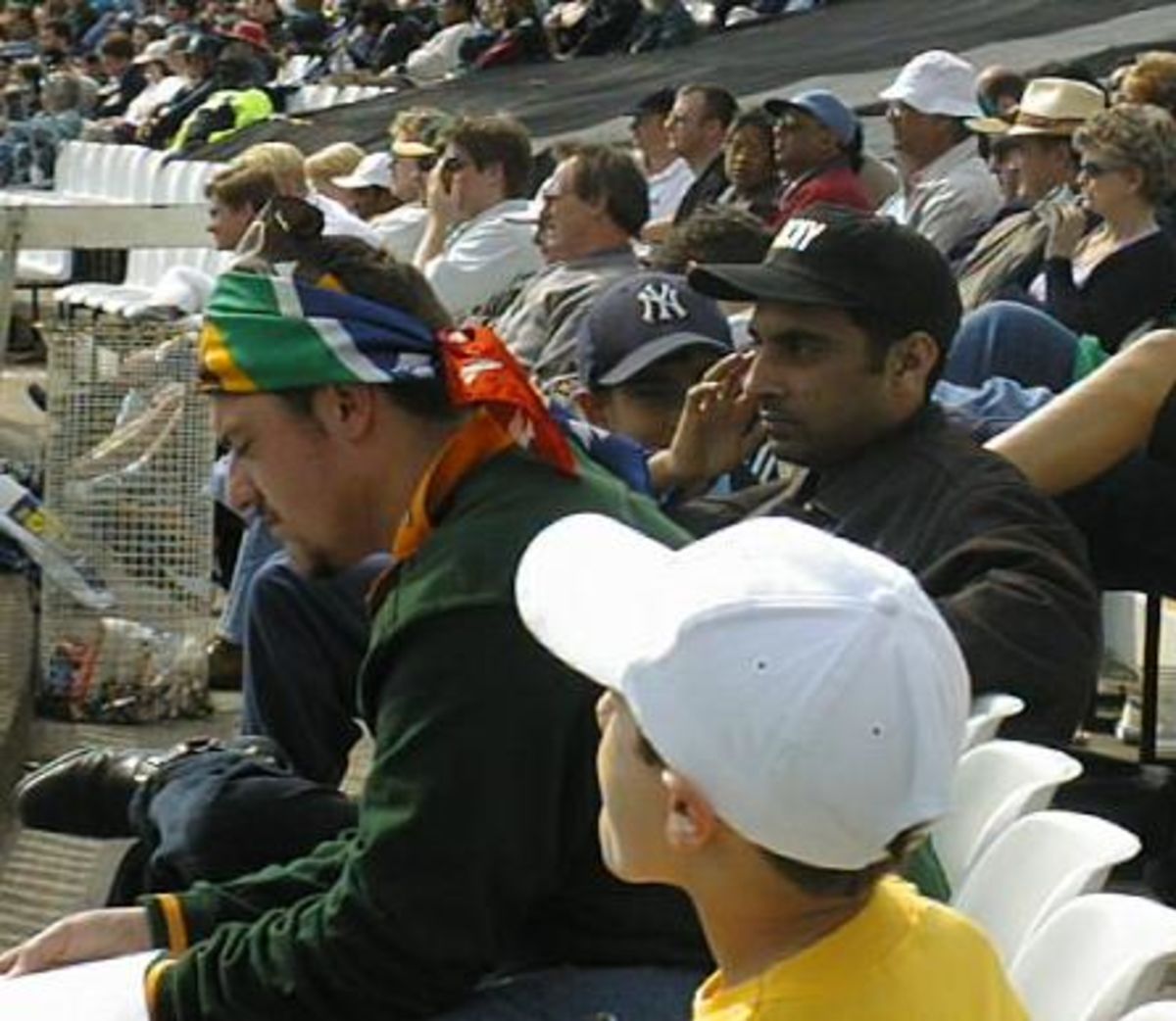 Fan wearing a flag in the stand watching cricket | ESPNcricinfo.com