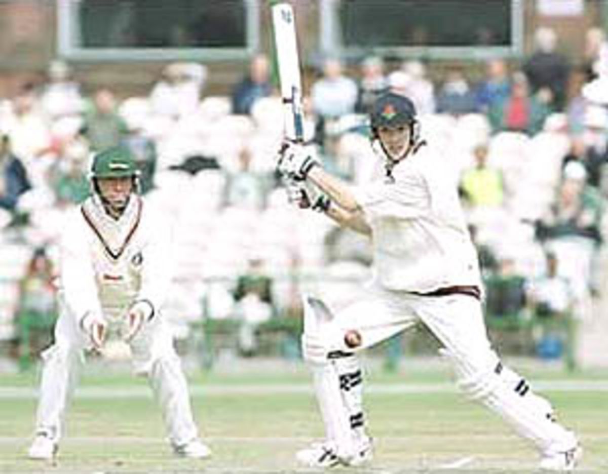 Chris Schofield plays a square cut as Trevor looks on | ESPNcricinfo.com