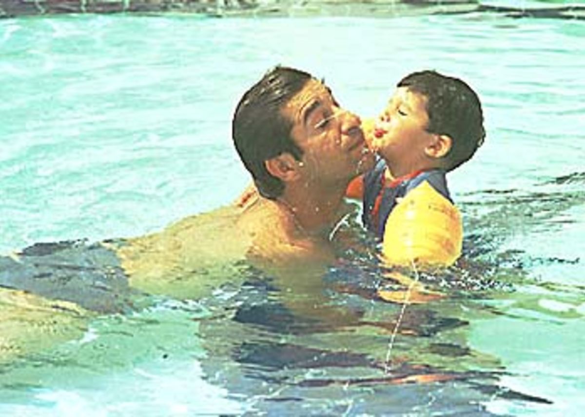 Wasim Akram enjoying a swim with his child | ESPNcricinfo.com