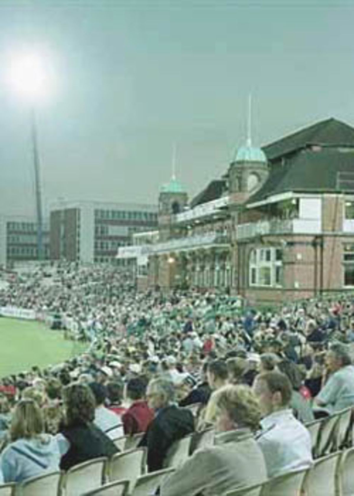 The Old Trafford pavilion basking in the glory of the flood lights ...