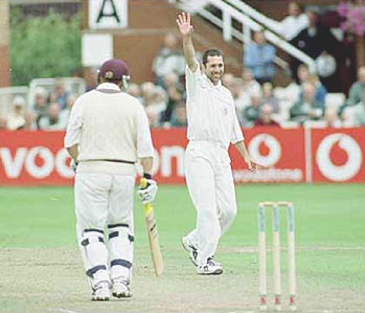 Scuderi watches in delight as Lathwell walks back to the pavilion after ...