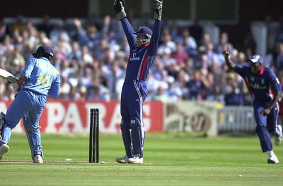 Stewart and Tudor acknowledge the wicket of Tendulkar, bowled by Giles ...