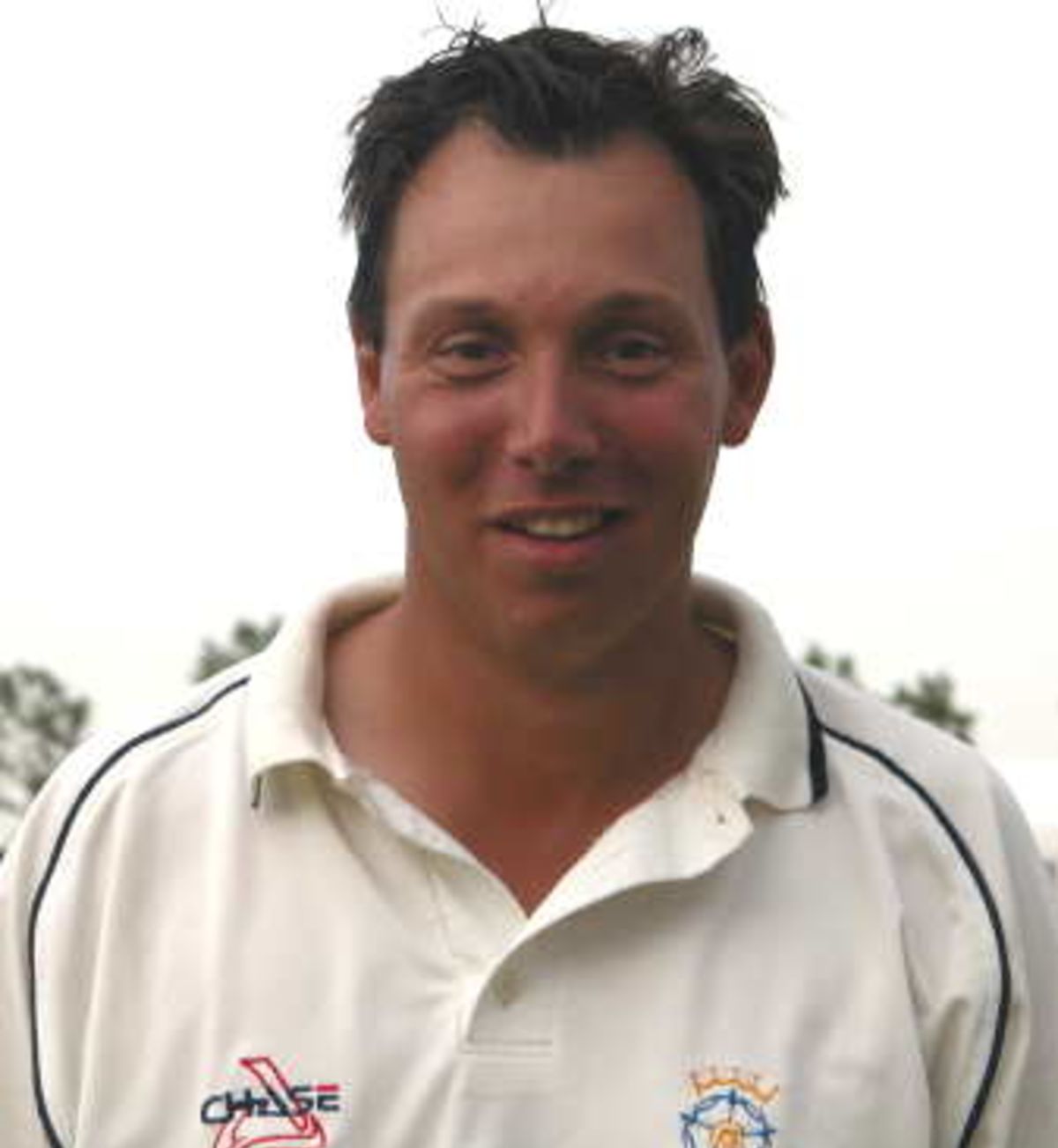 Oman's Adnan Ilyas guides the ball past Hong Kong 'keeper Matthew Lind ...