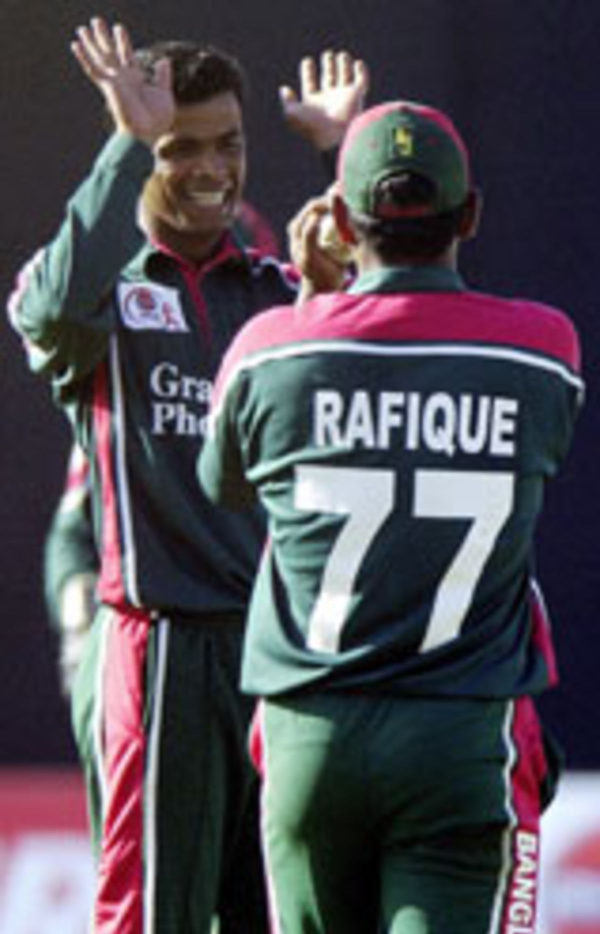 Abdur Razzaq and Mohammad Rafique celebrate the wicket of a Hong Kong ...